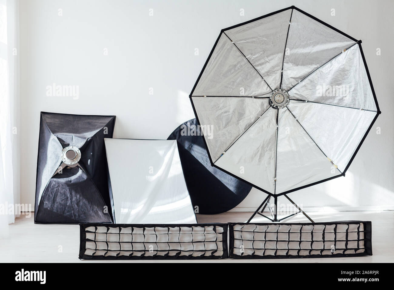 Photo studio equipment flash accessories photographer on background ...