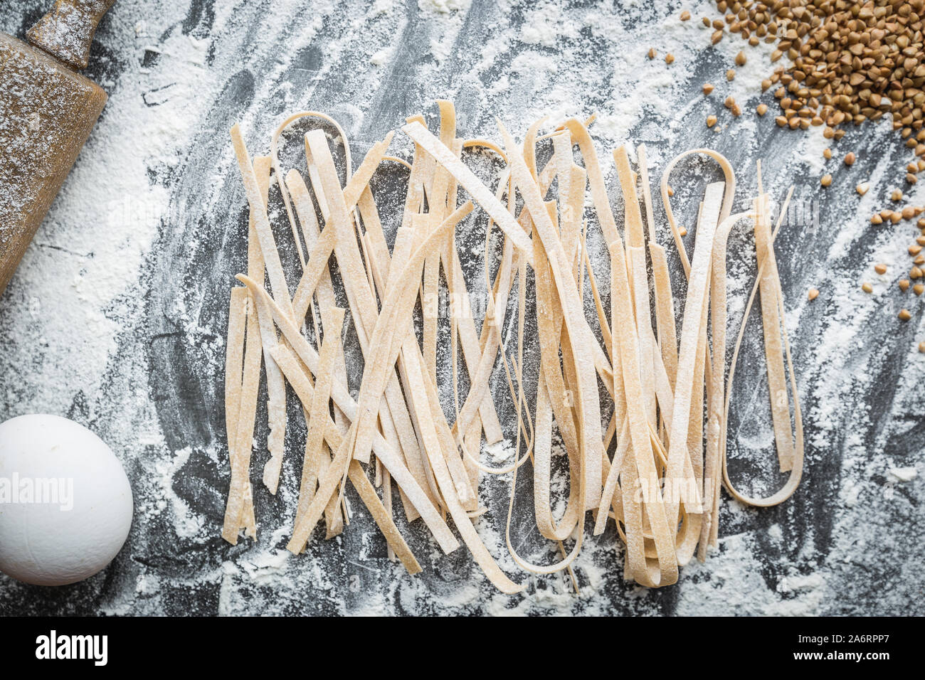 Homemade buckwheat noodles on black background, top view Stock Photo ...