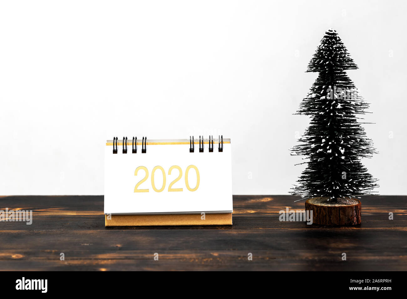New Year 2020 Calendar with Pine Tree on top of wooden desk Stock Photo ...
