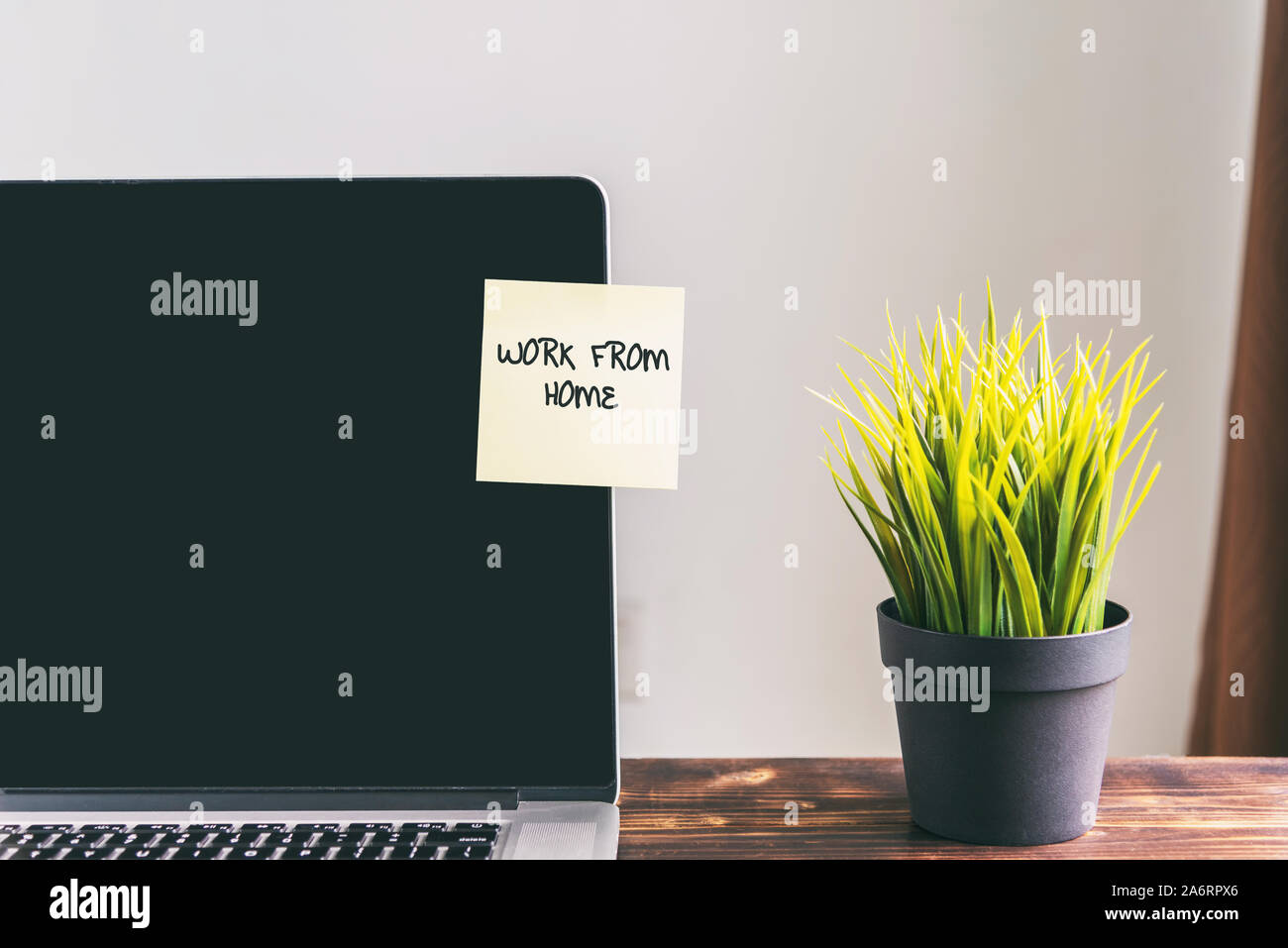 Work From Home text note on a laptop screen Stock Photo - Alamy