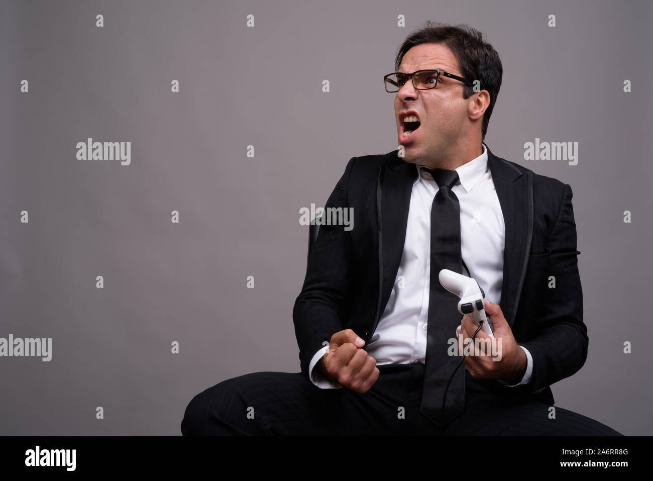 Man sitting in chair screaming hi-res stock photography and images - Alamy