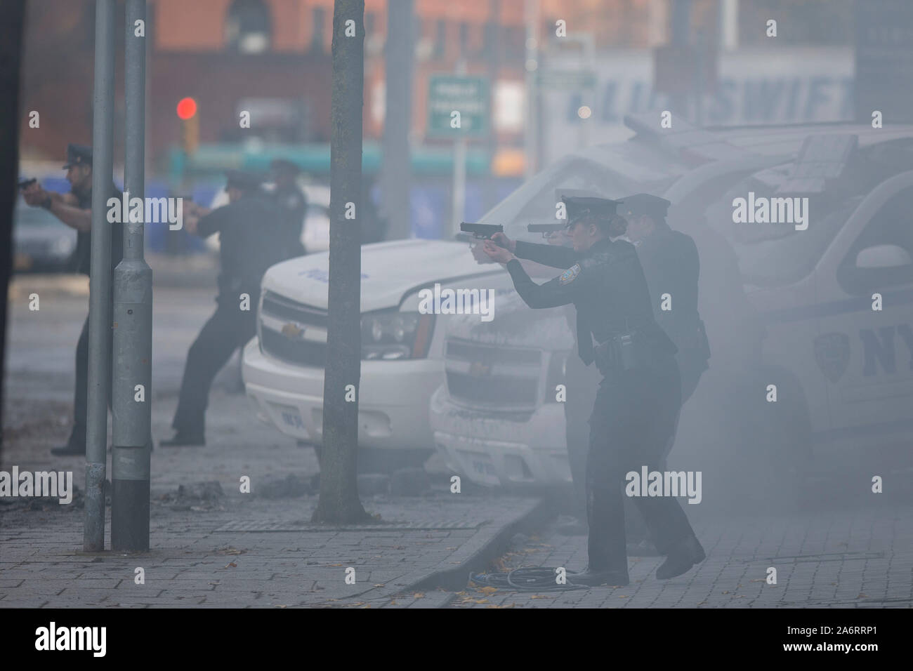 New York Police actors with raised pistols during filming for the movie ...