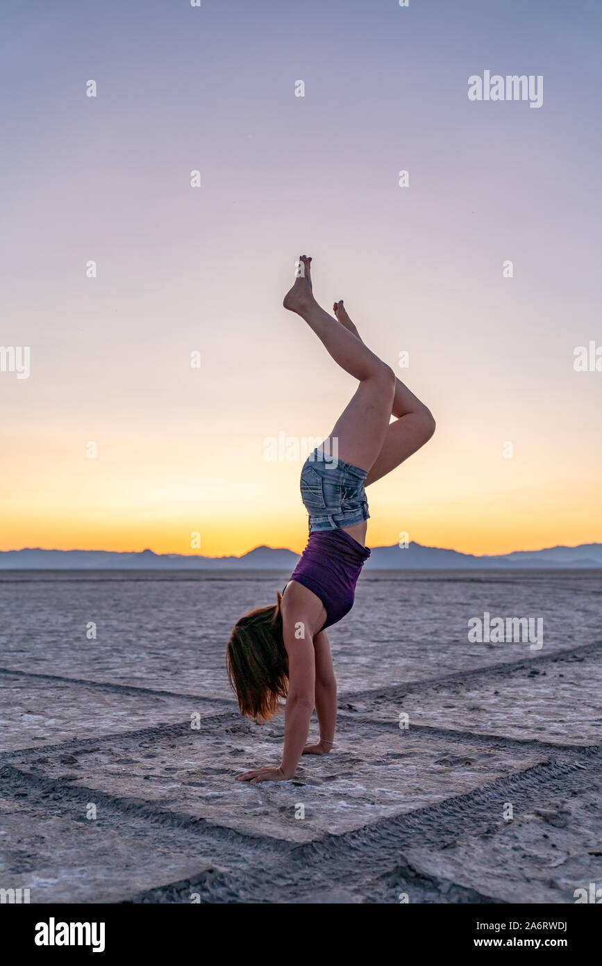 Beautiful Woman Doing Handstands During Sunset in Bonneville Salt flats ...