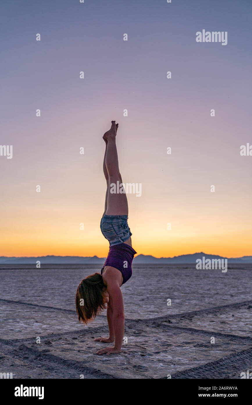 Beautiful Woman Doing Handstands During Sunset in Bonneville Salt flats ...