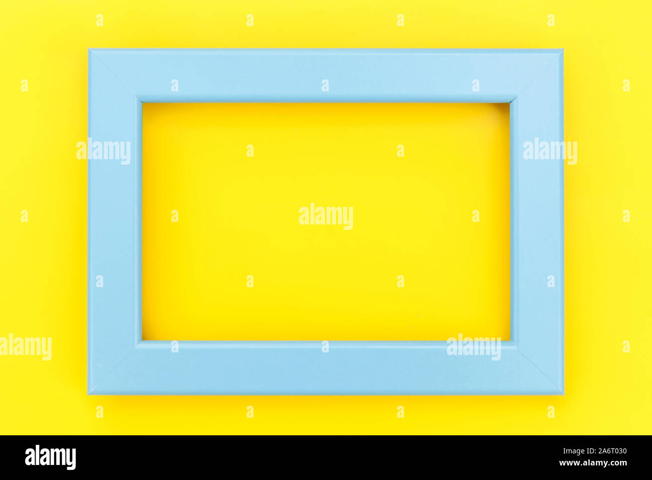 Simply design with empty blue frame isolated on yellow colourful trendy ...