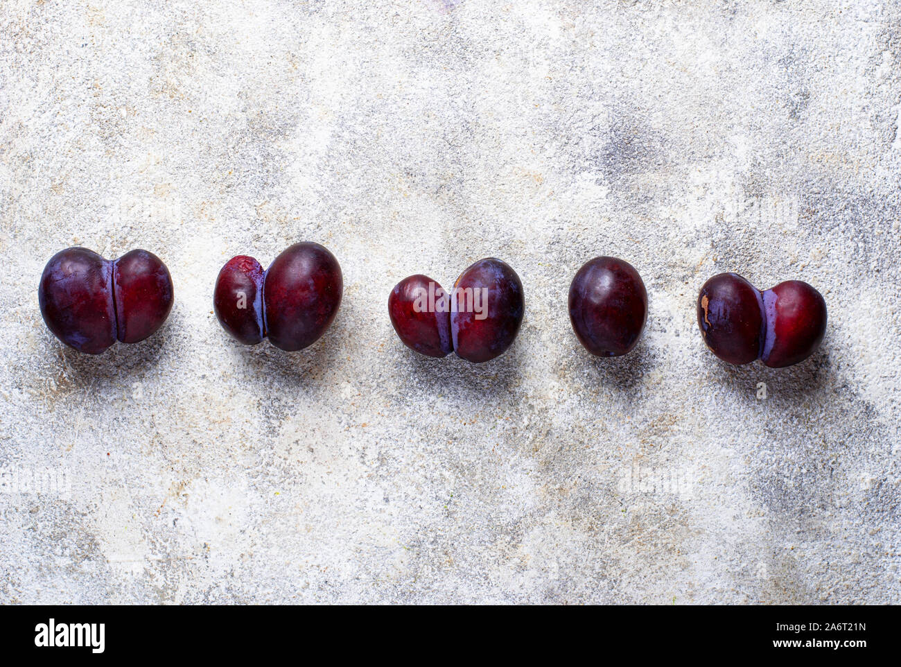 Ugly and normal plums. Abnormal organic fruit Stock Photo - Alamy