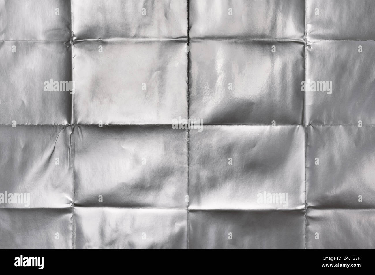 Silver wrapping paper with scratches and folds, texture background ...