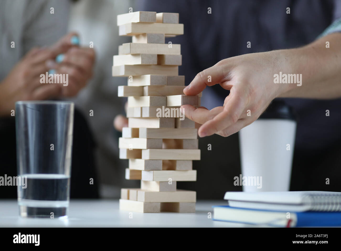 Woman build tower from hi-res stock photography and images - Alamy