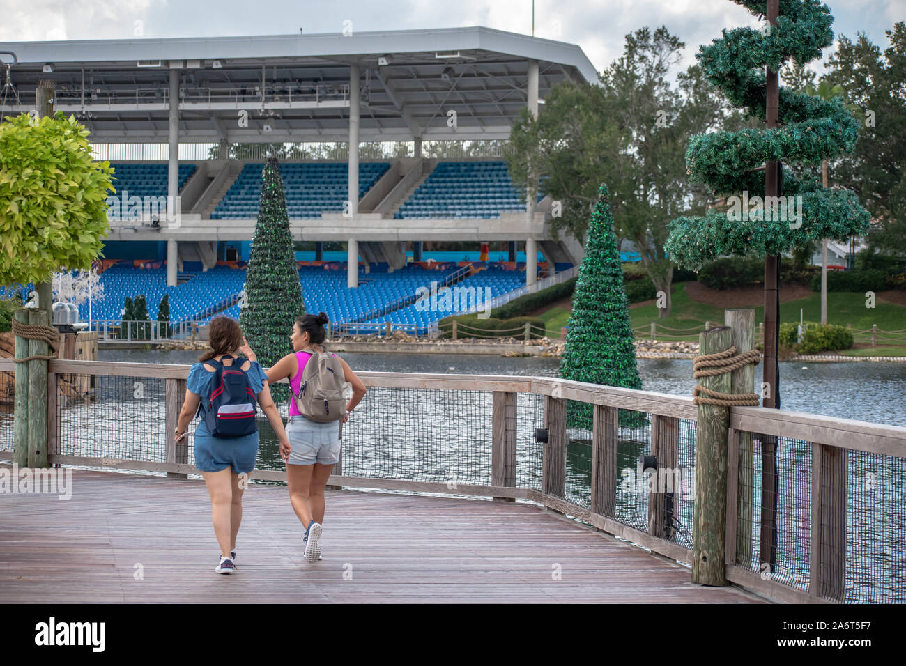 Orlando, Florida. October 24, 2019. Girls walking on Seven Seas lake ...
