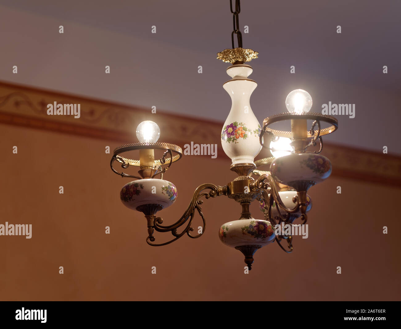 Vintage Porcelain Chandelier hanging from the ceiling Stock Photo - Alamy