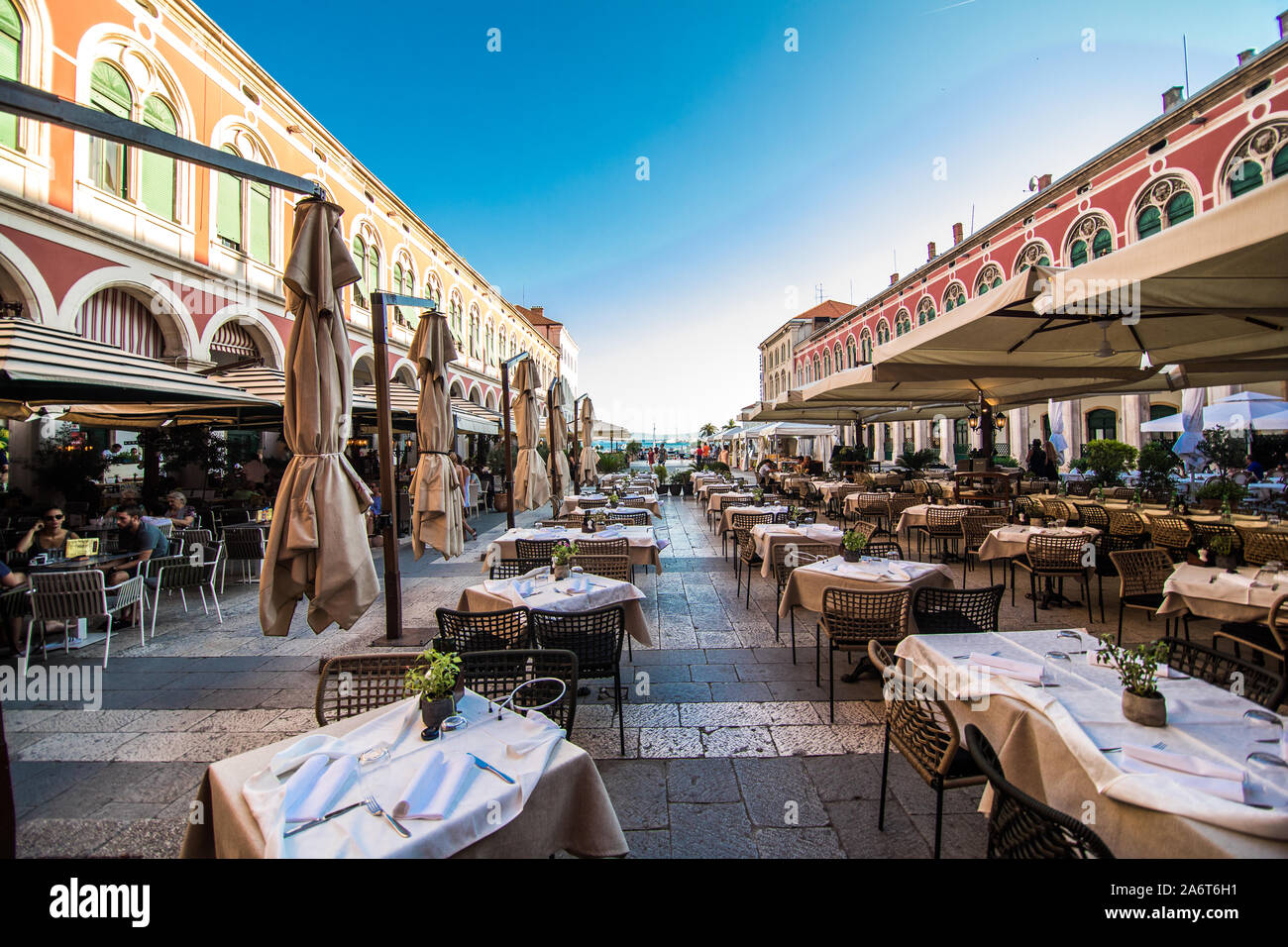City Cafe Perspective View With Palms, Sunny Day and Blue Sky. Split ...