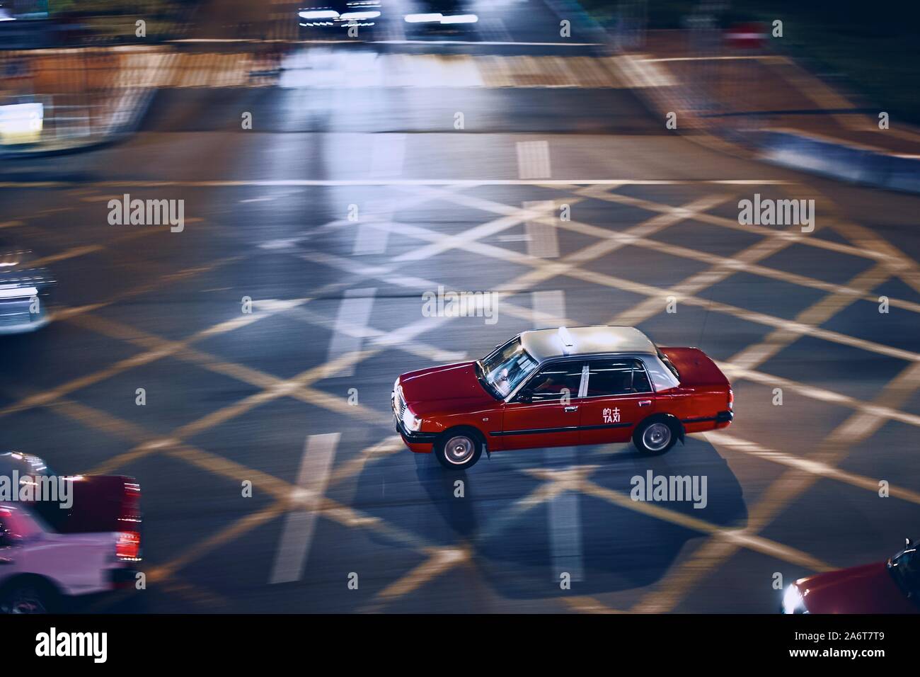 Red taxi at night hong kong hi-res stock photography and images - Alamy