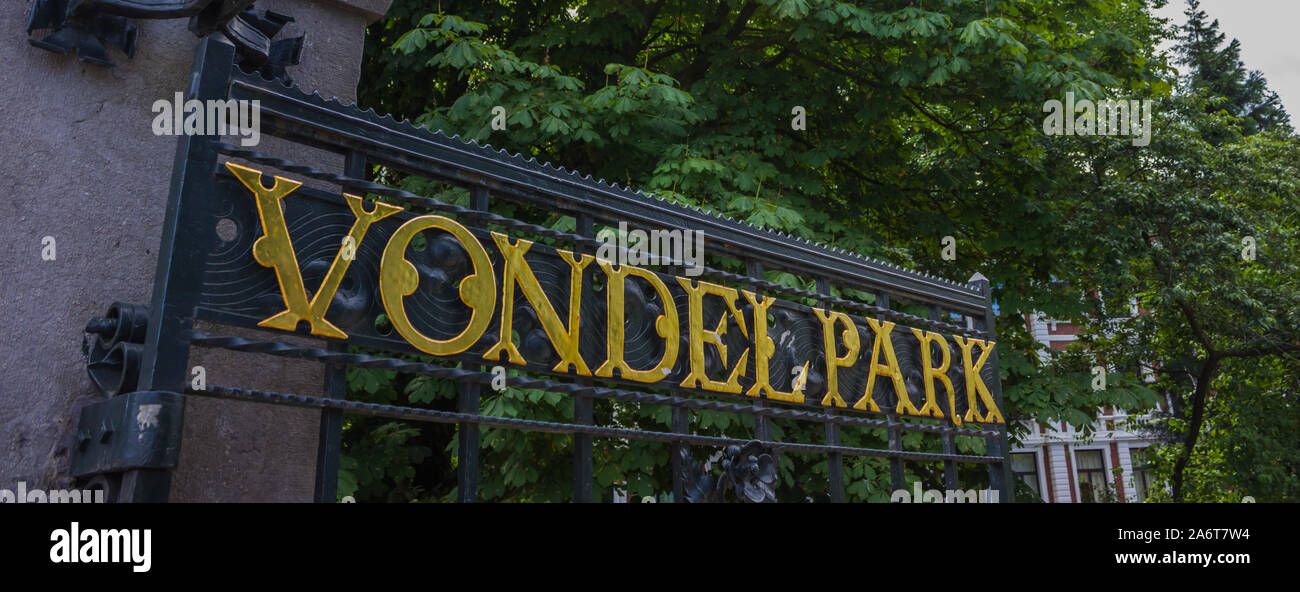 A picture of a metal gate that marks the entrance to Vondelpark ...