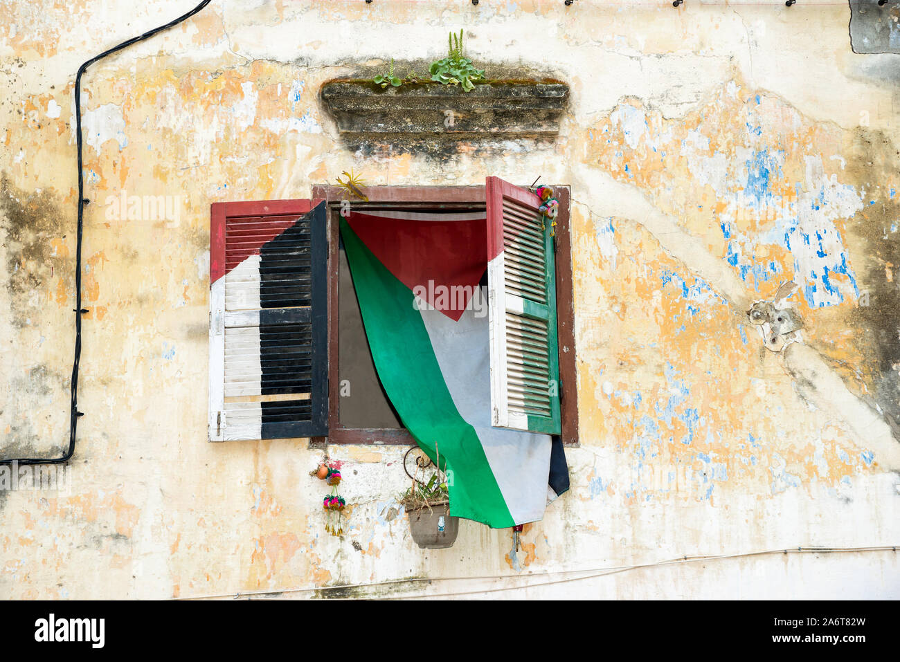 Palestine flag hanging in window in Tangier, Morocco Stock Photo - Alamy