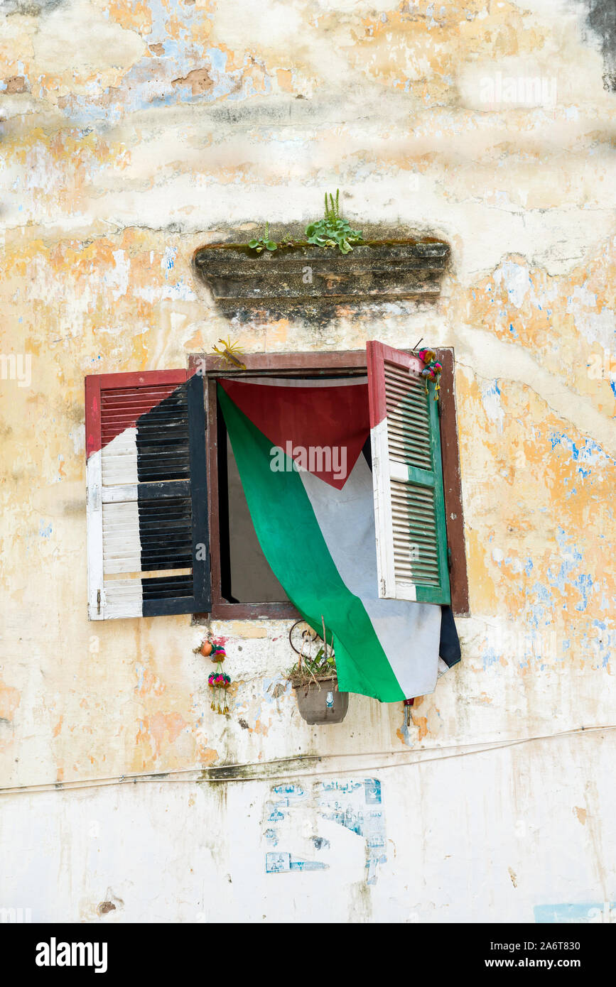 Palestine flag hanging in window in Tangier, Morocco Stock Photo - Alamy