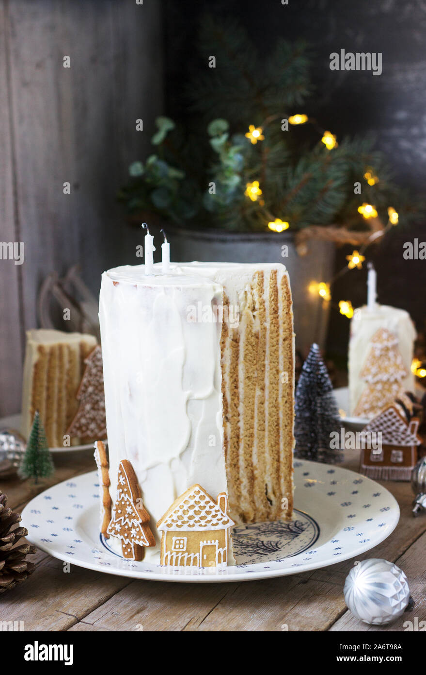 Homemade honey cake with sour cream, decorated with gingerbread. Rustic ...