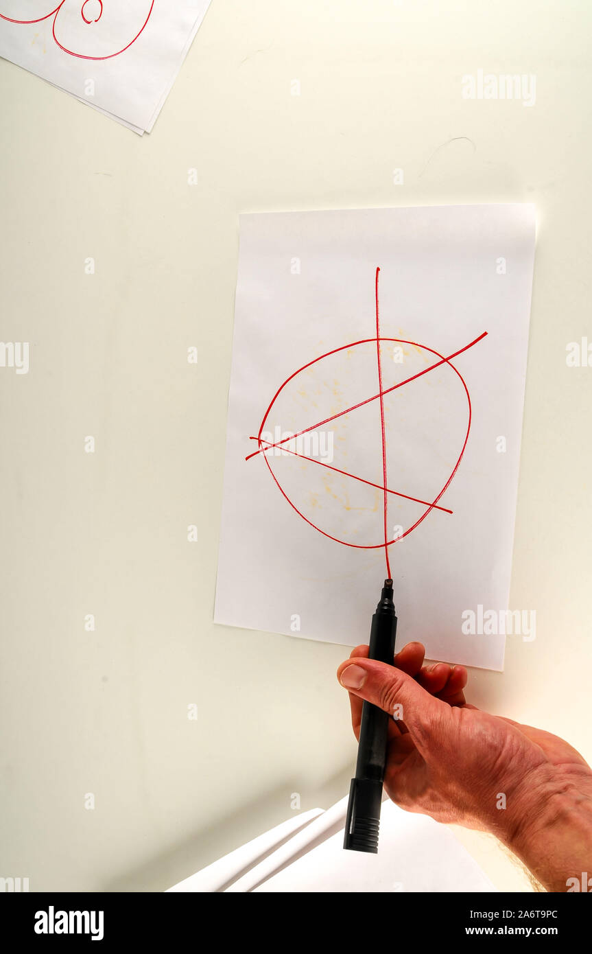 Close-up of sheet with drawing anarchy symbol Object on a White ...