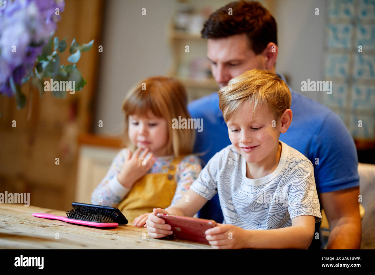 Father interacting with kids Stock Photo - Alamy