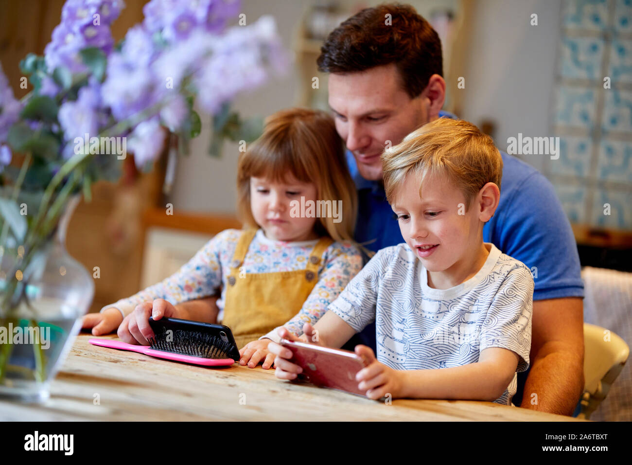 Father interacting with kids Stock Photo - Alamy