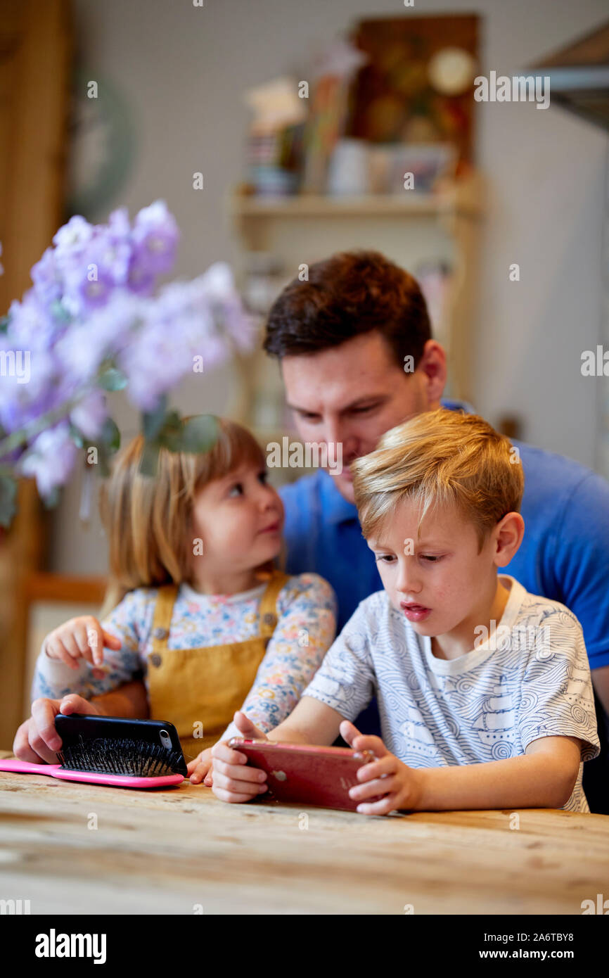 Father interacting with kids Stock Photo - Alamy