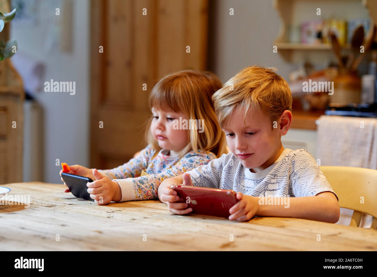 Children playing on devices Stock Photo - Alamy