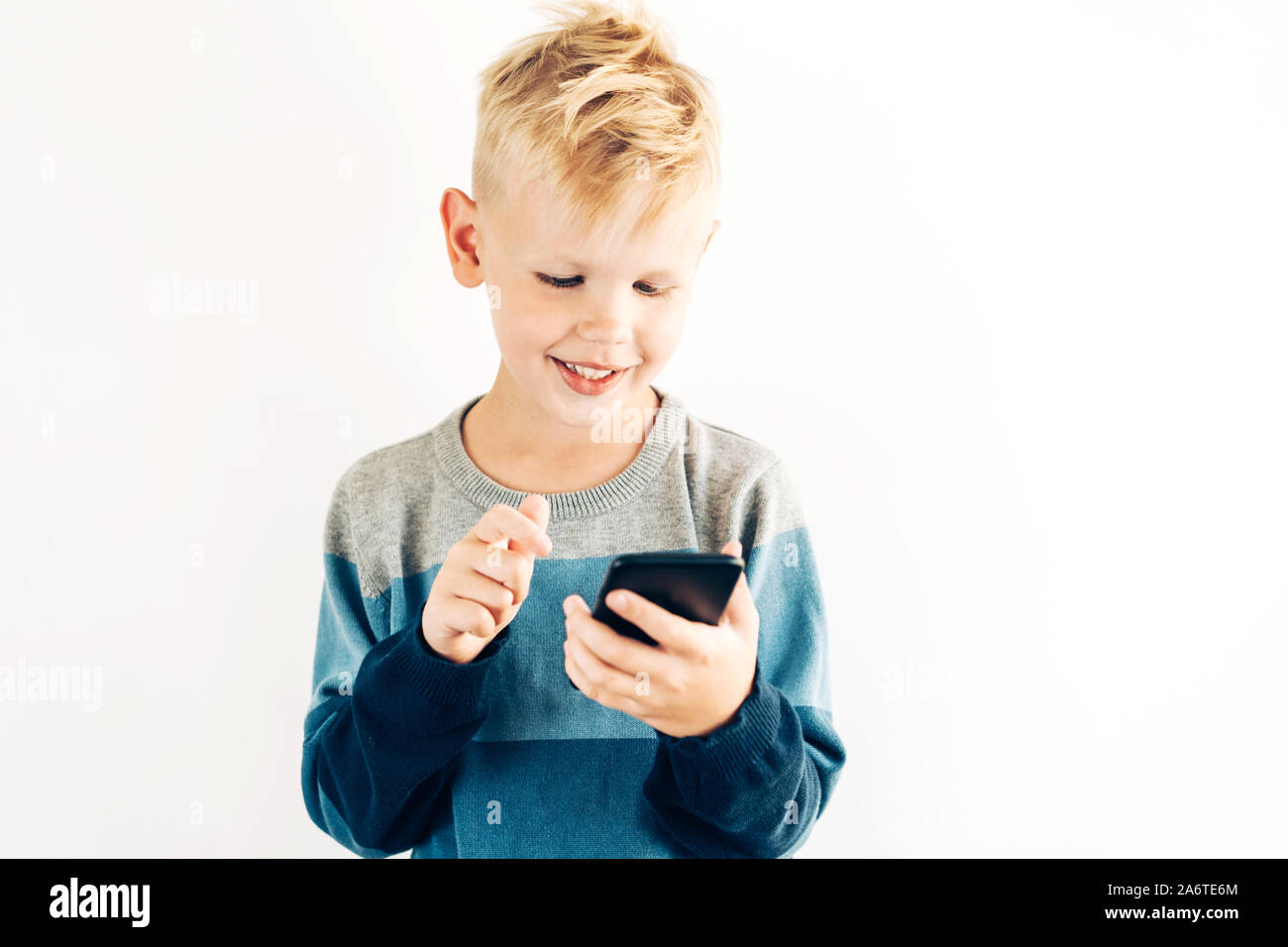 .teenager boy with phone Stock Photo - Alamy
