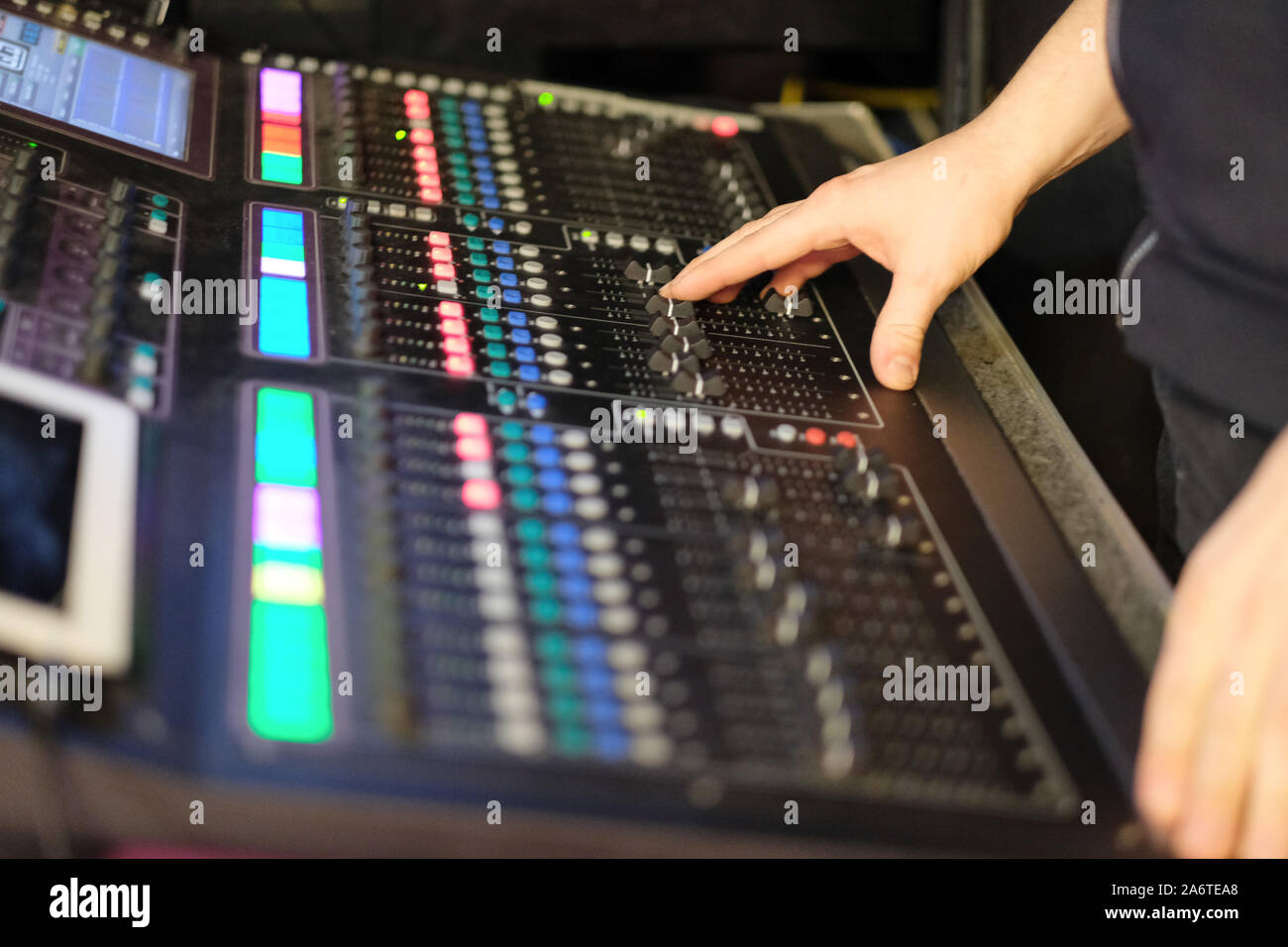 The sound engineer at work behind a mixing console at a concert Stock ...