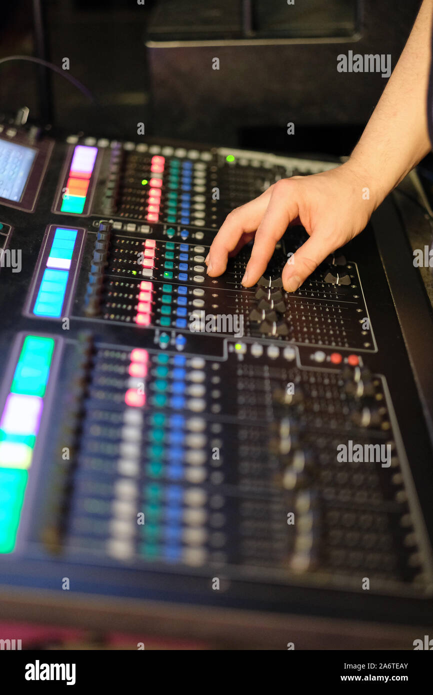 The sound engineer at work behind a mixing console at a concert Stock ...