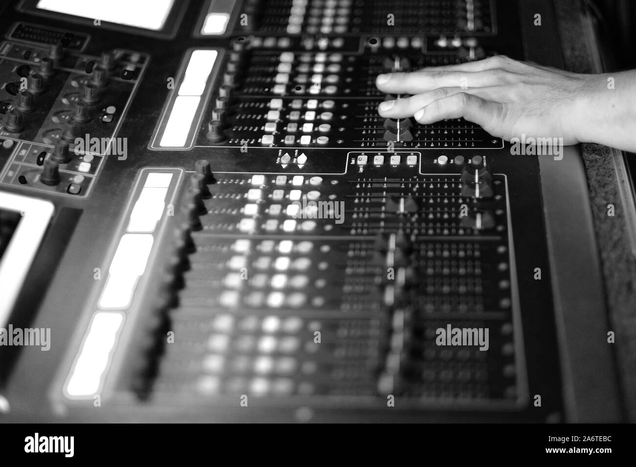 The sound engineer at work behind a mixing console at a concert Stock ...