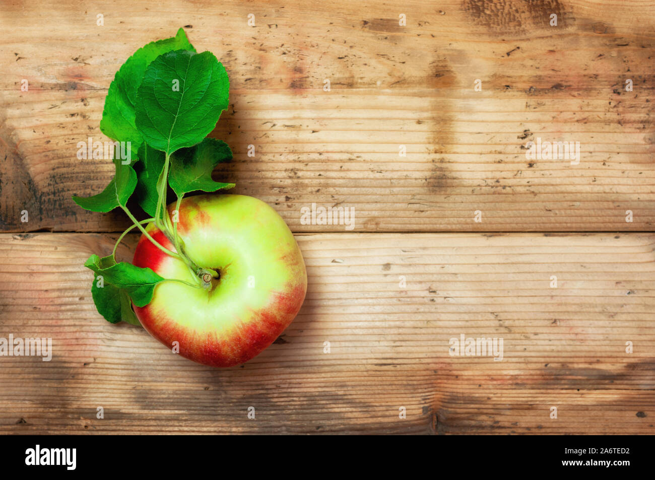 Apple on wooden table top view Stock Photo - Alamy