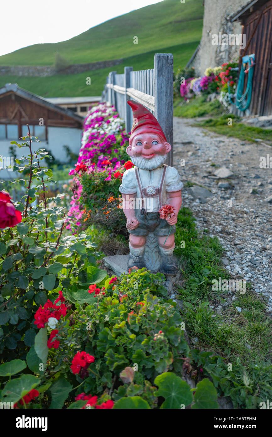 Happy Tirolian Gnome in the South Tirol in Italian Alps Stock Photo - Alamy