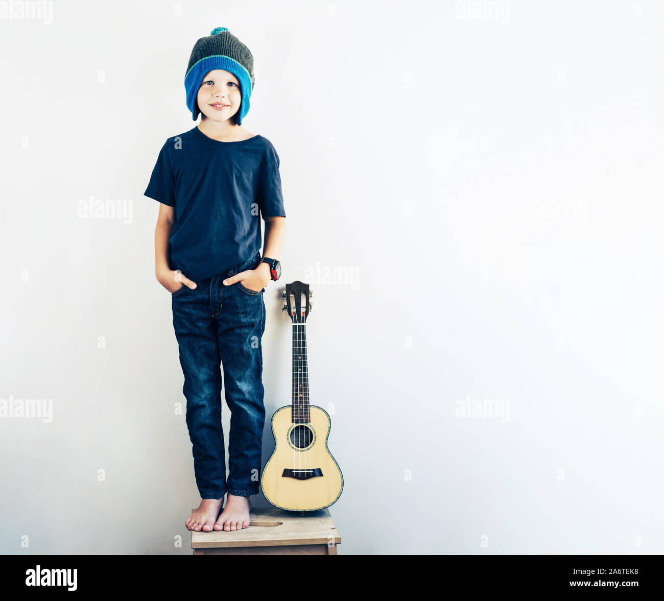 stylish boy with ukulele Stock Photo - Alamy