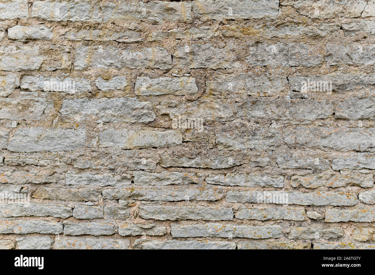 Magnificent old limestone brick wall. Can be used as background or ...