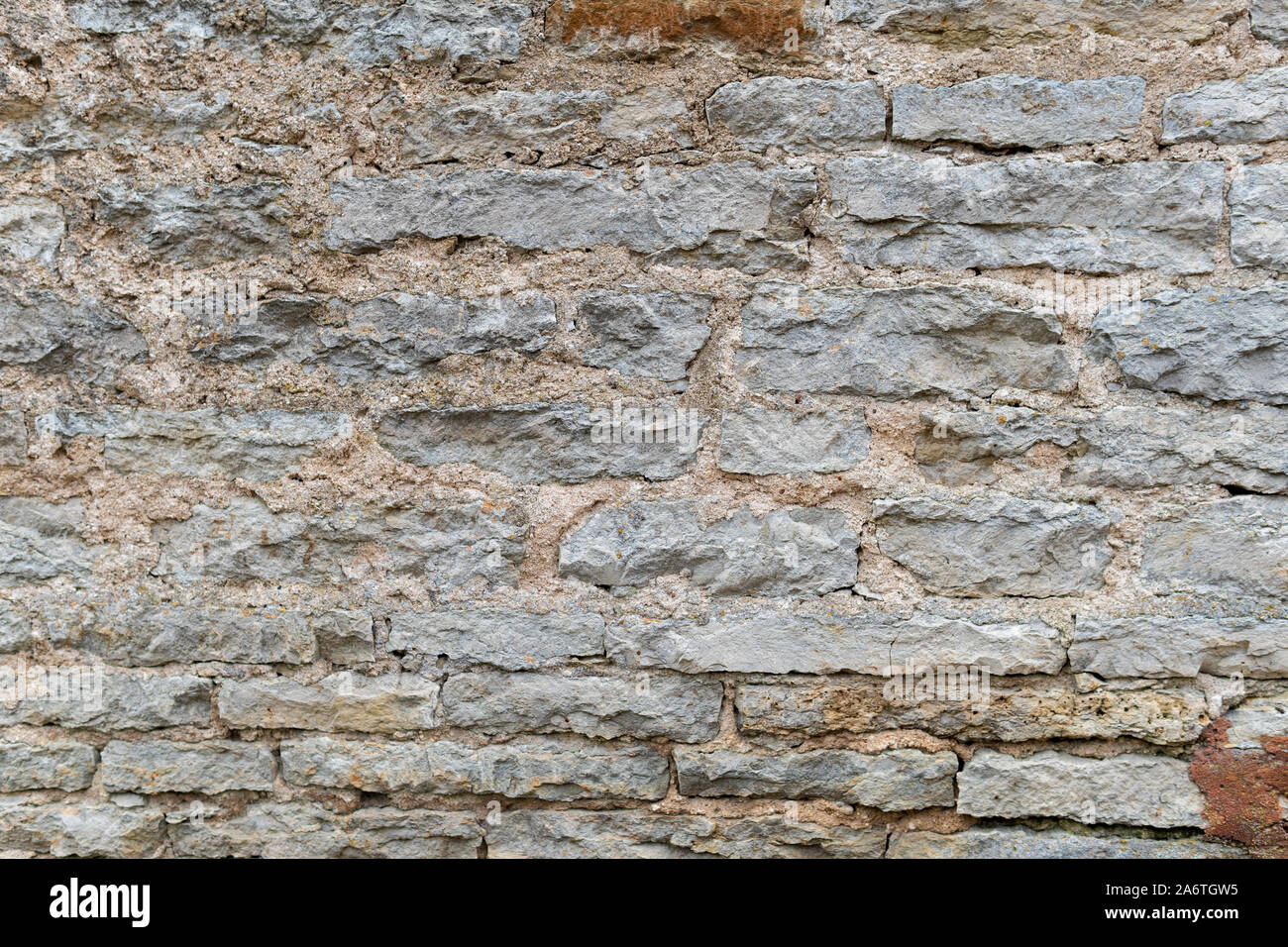 Magnificent old limestone brick wall. Can be used as background or ...