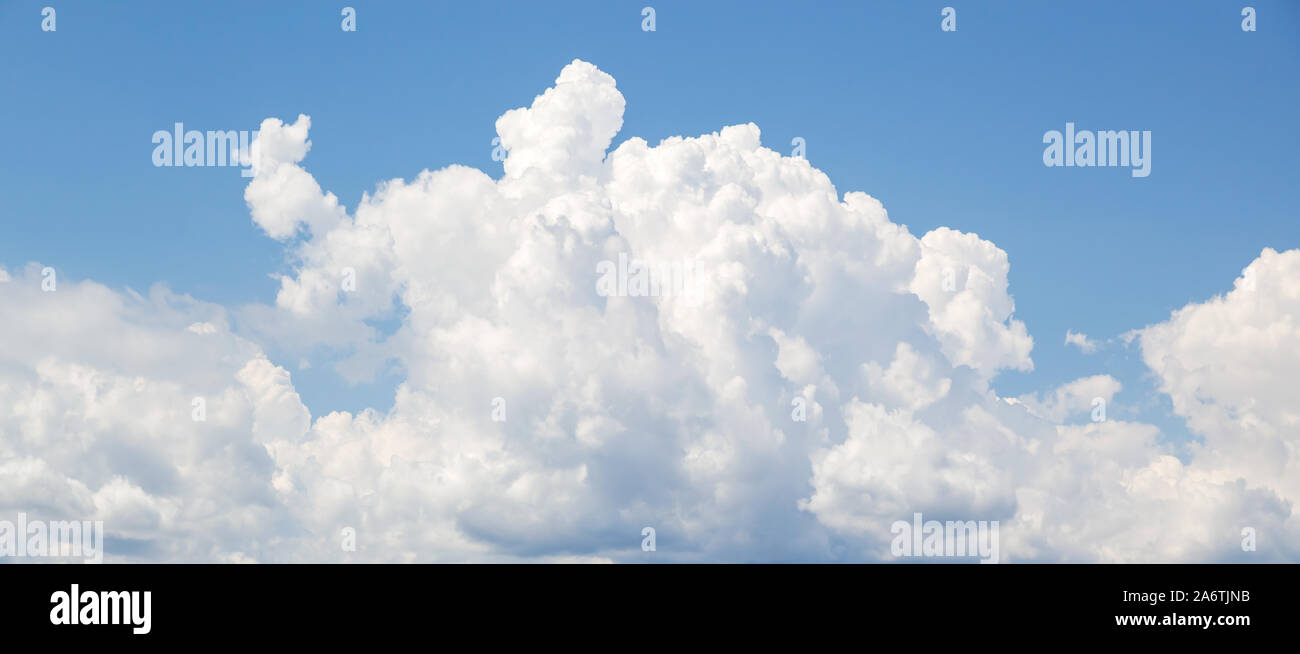 White cumulus clouds formation in blue sky at daytime. Natural ...