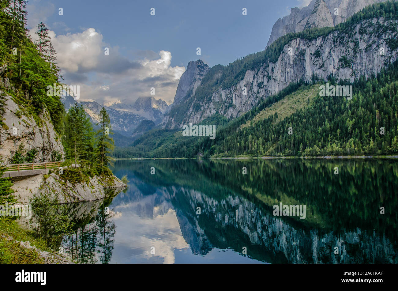 Dachstein glacier rising behind the mountain lake gosau hi-res stock ...