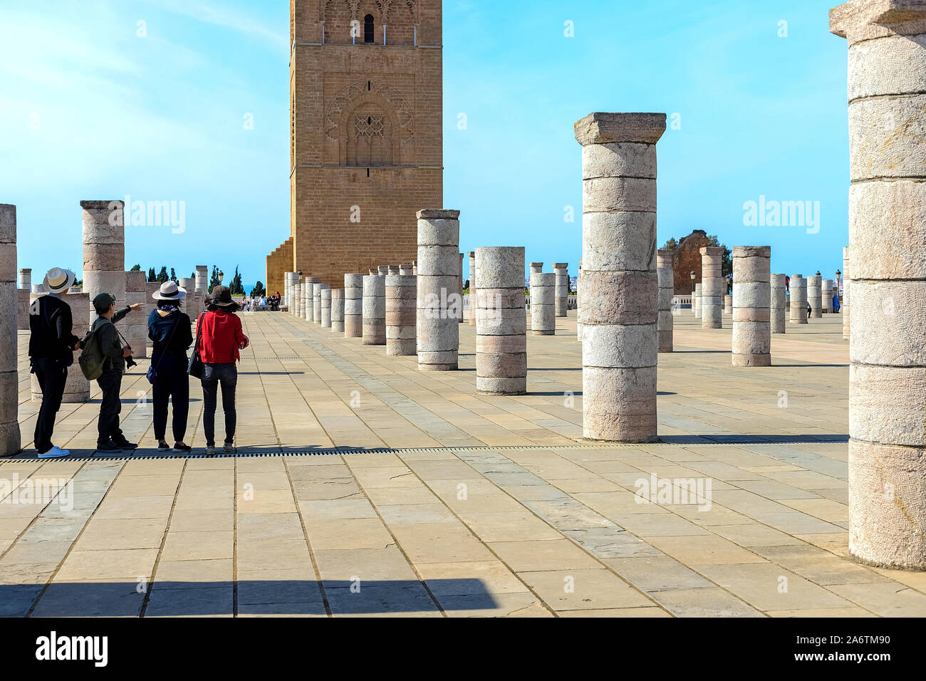 View of the square with ruins and the Hassan tower against the blue sky ...