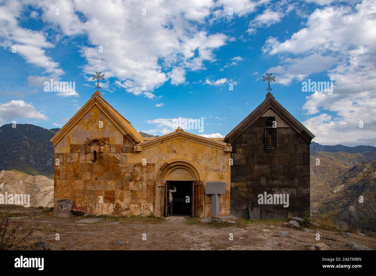 Monastery of light and dark stone against the cloudy sky Stock Photo ...