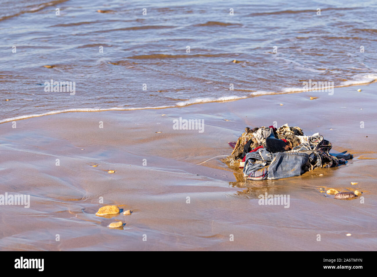 Clothes, plastic and household waste rubbish washed up from the ...
