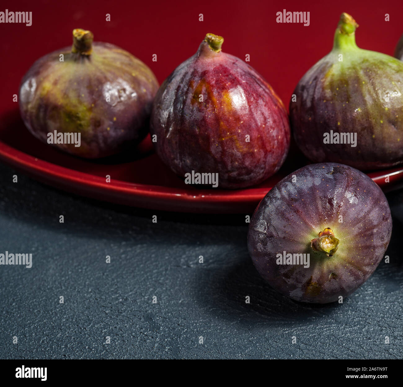 fresh figs close-up photo on black background. dark moody photo Stock ...