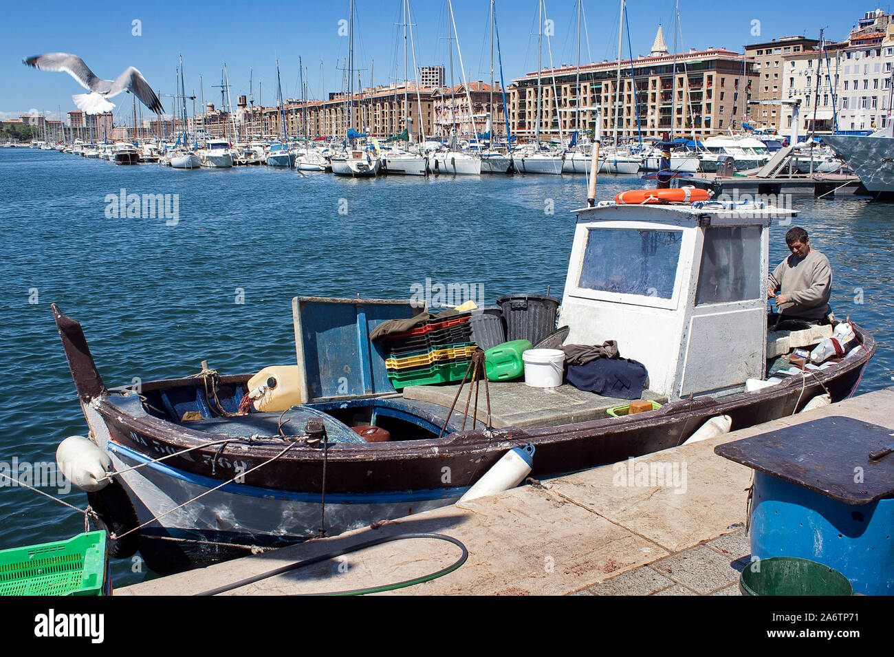 Fishing boat beside the open air fish market at the Old Port, Marseille ...