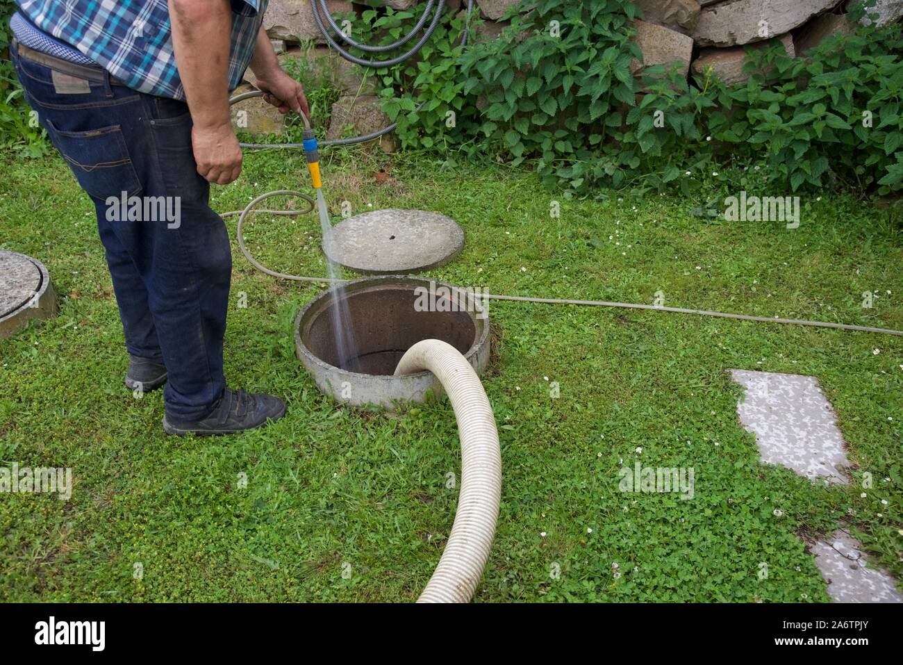 Septic tank: the removal of sewage sludge and cleaning of a domestic ...