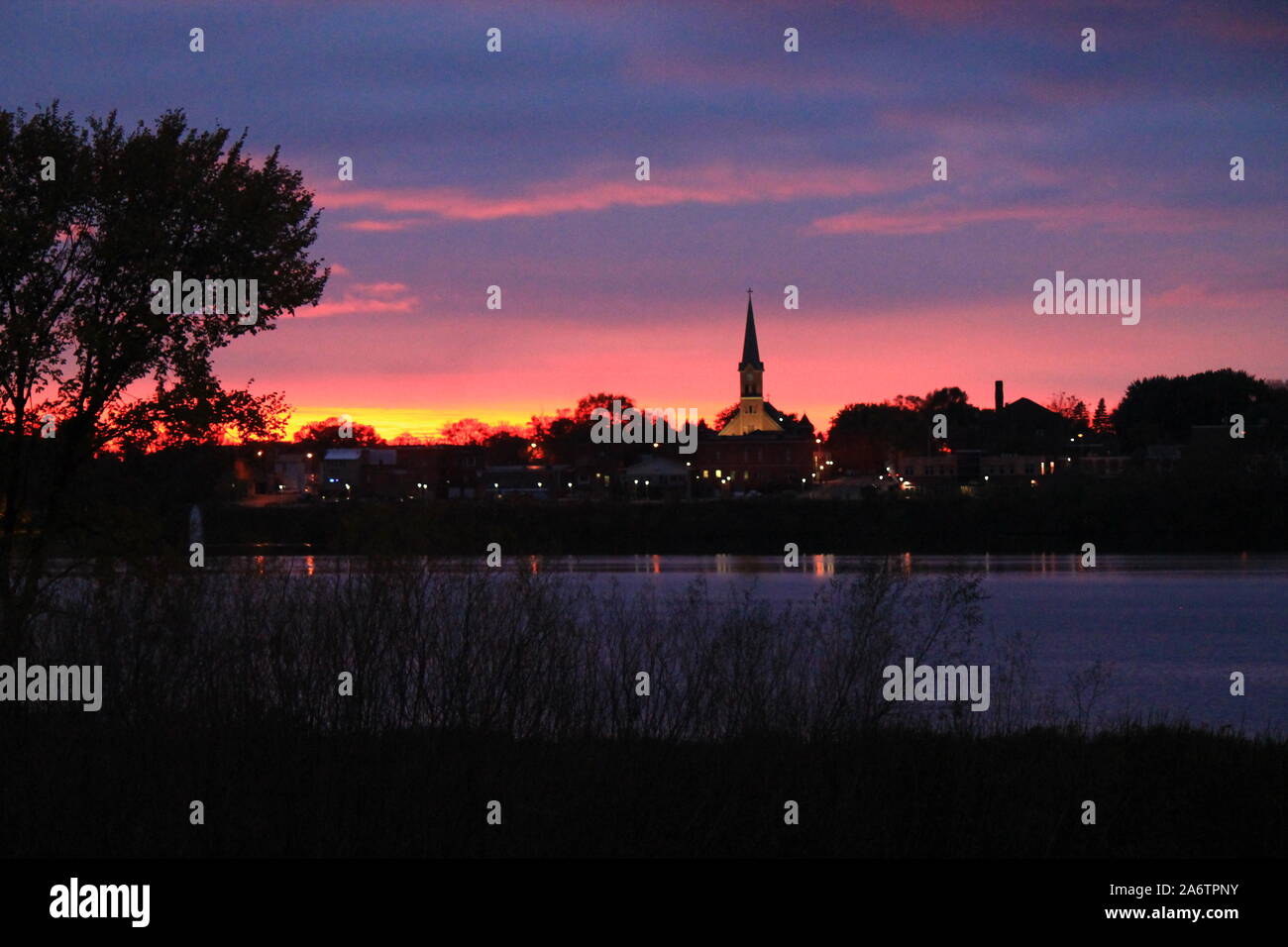 Church with beautiful vivid sunset Stock Photo - Alamy