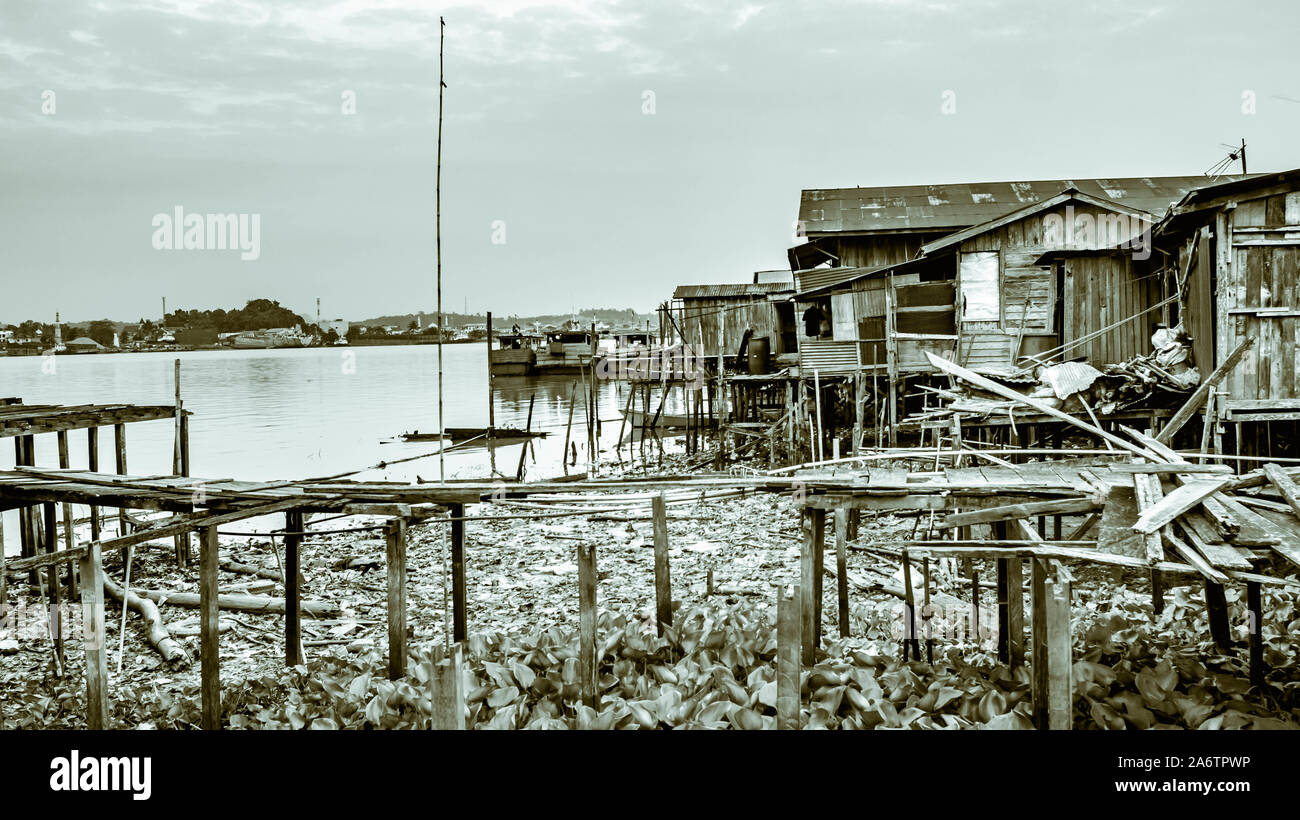 slum wooden house on Mahakam Riverbank. Poverty and social issues Stock ...