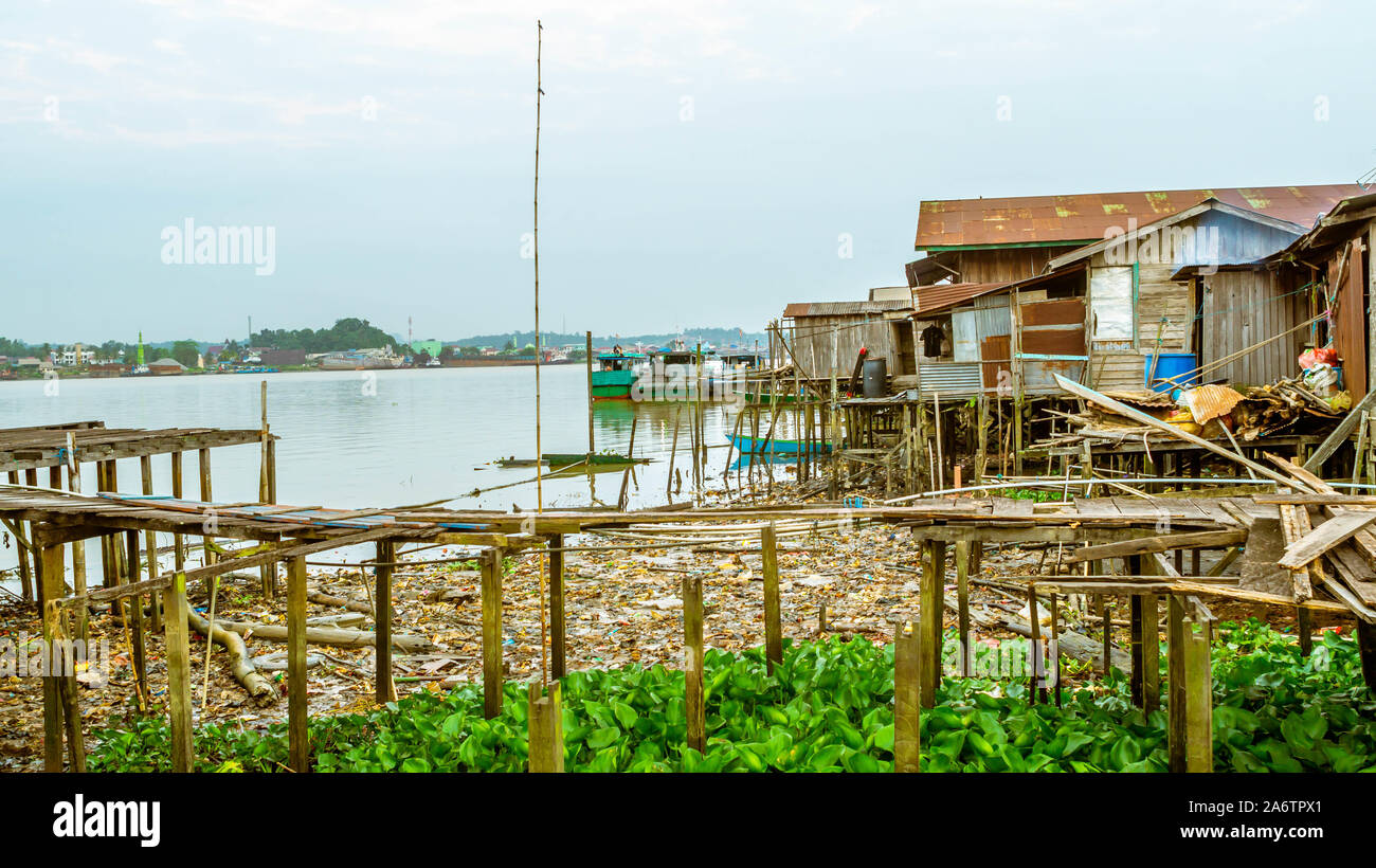 slum wooden house on Mahakam Riverbank. Poverty and social issues Stock ...