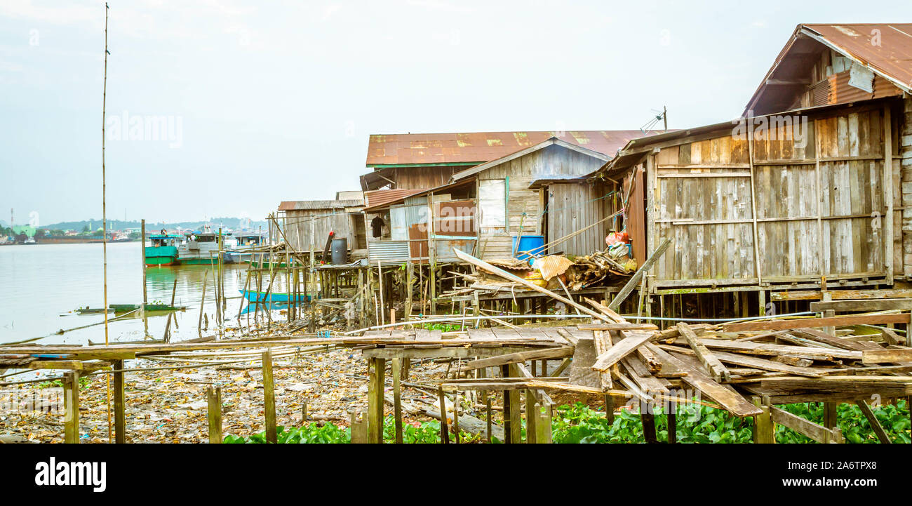 slum wooden house on Mahakam Riverbank. Poverty and social issues Stock ...