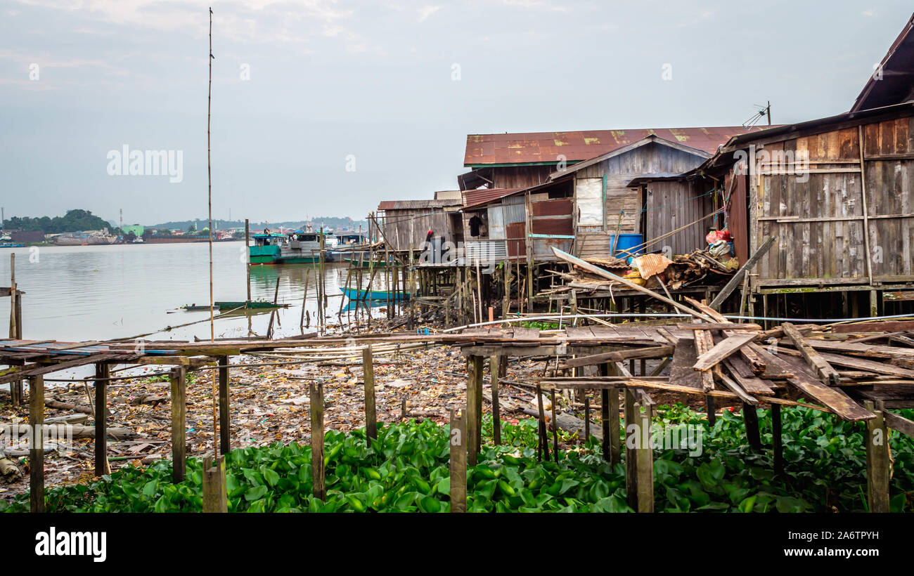 slum wooden house on Mahakam Riverbank. Poverty and social issues Stock ...