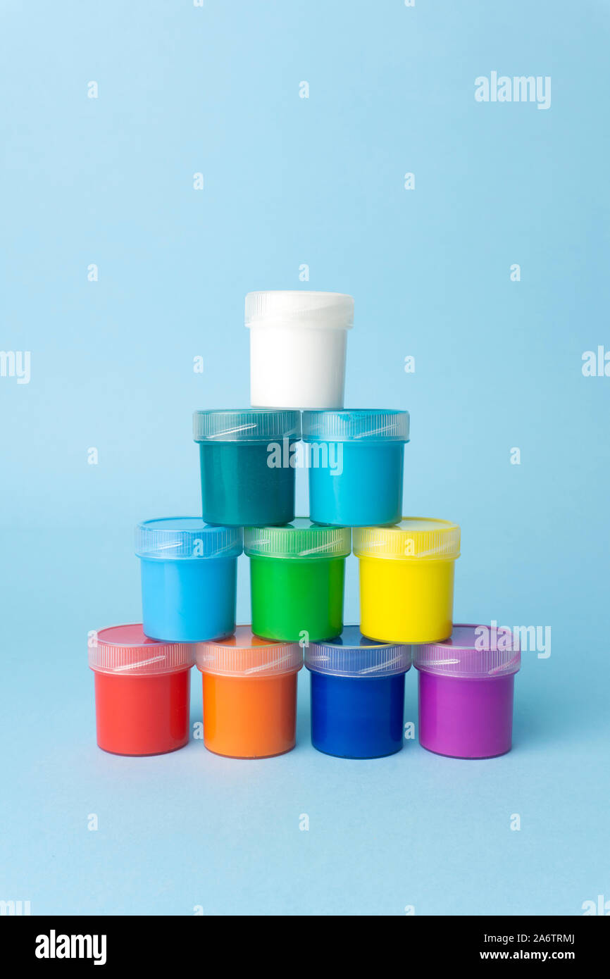 Colored paints on a clear blue background. Bright color paints for ...