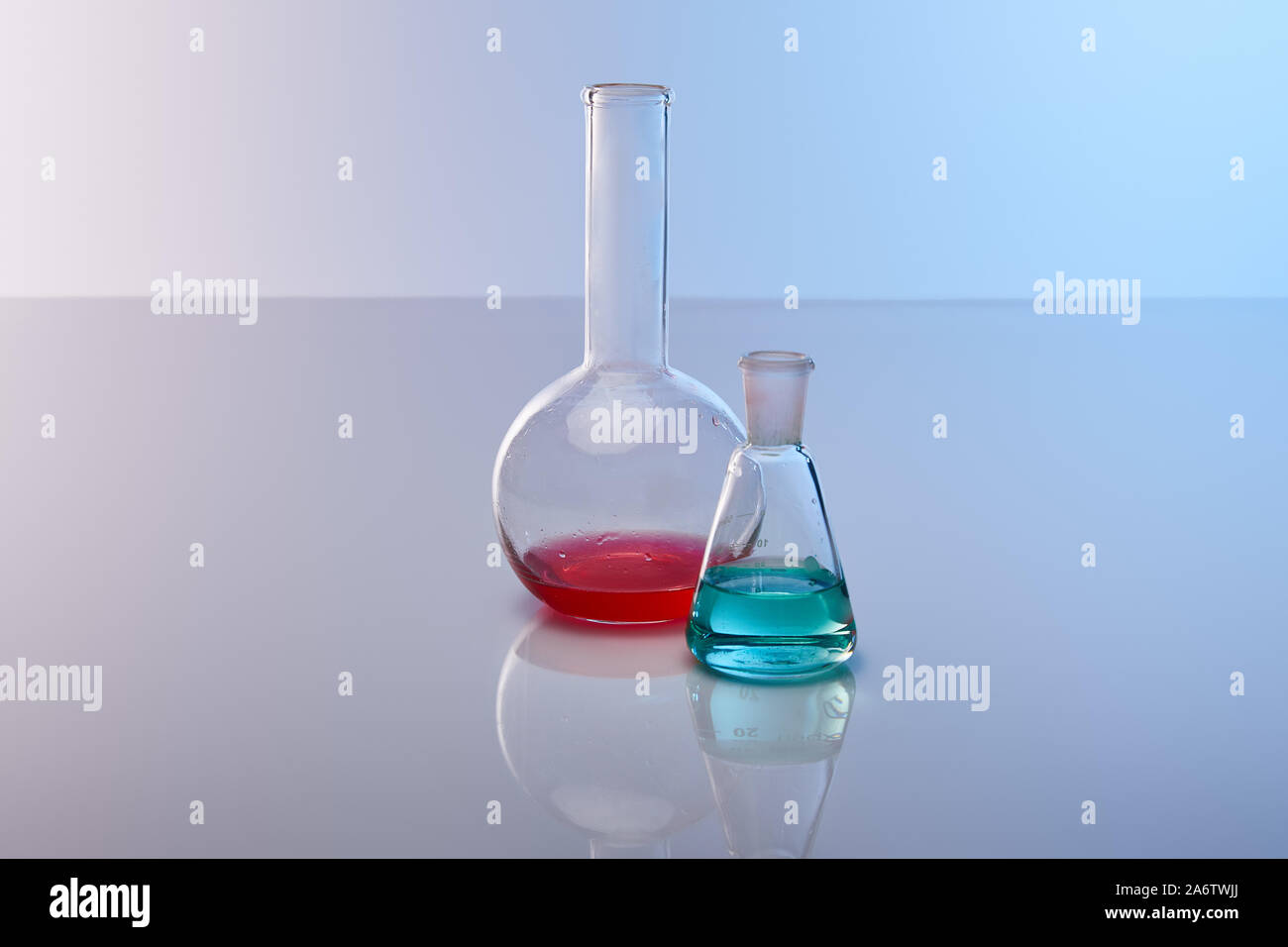 glass flasks with colorful blue and red liquid Stock Photo - Alamy