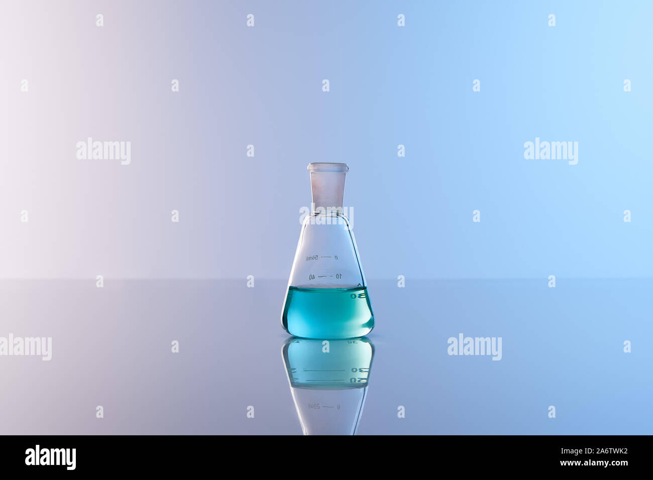 glass flask with blue colorful liquid Stock Photo - Alamy
